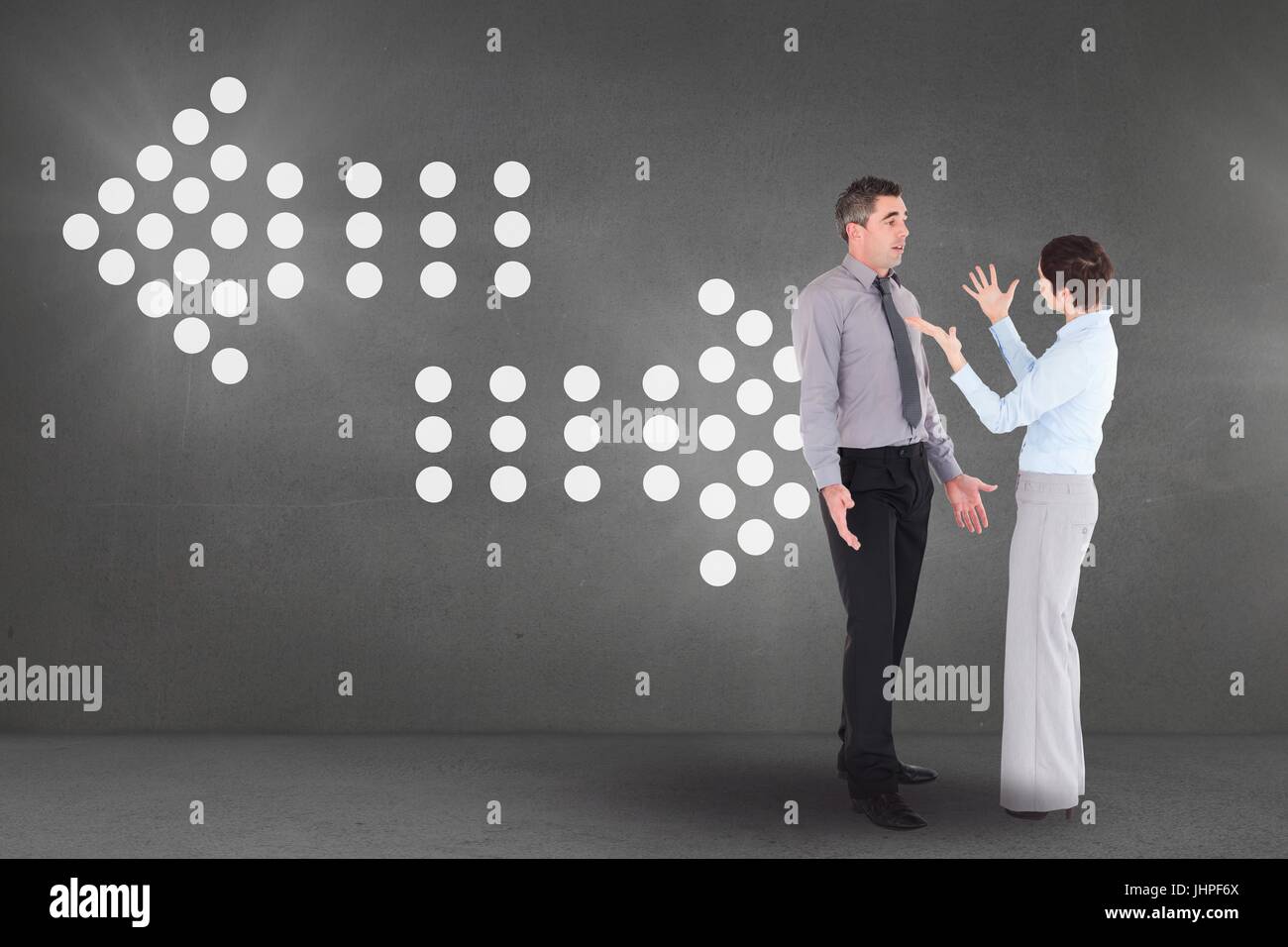 Digital composite of Business people arguing against grey background ...