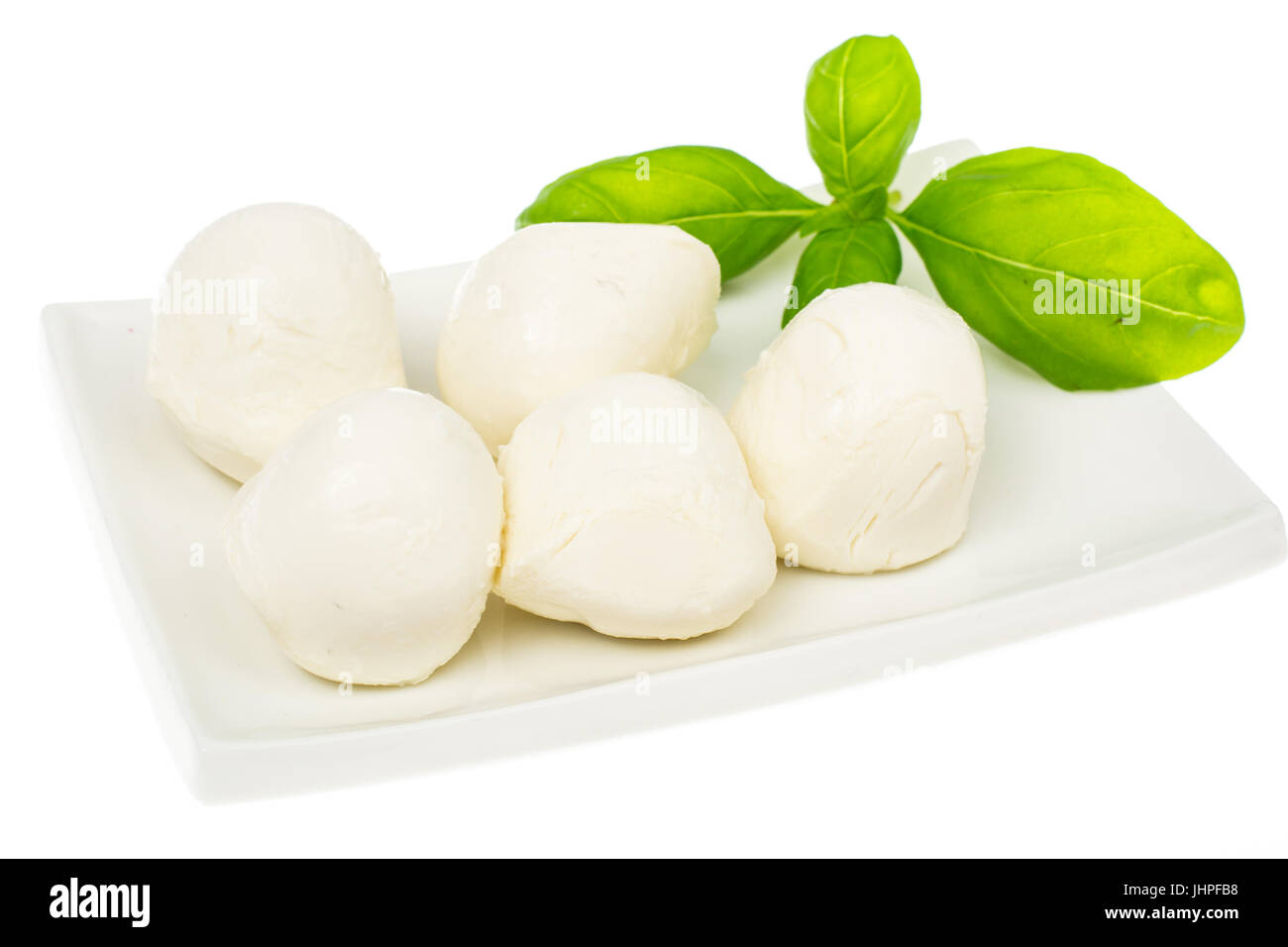 Mozzarella balls on white plate. Studio Photo Stock Photo - Alamy