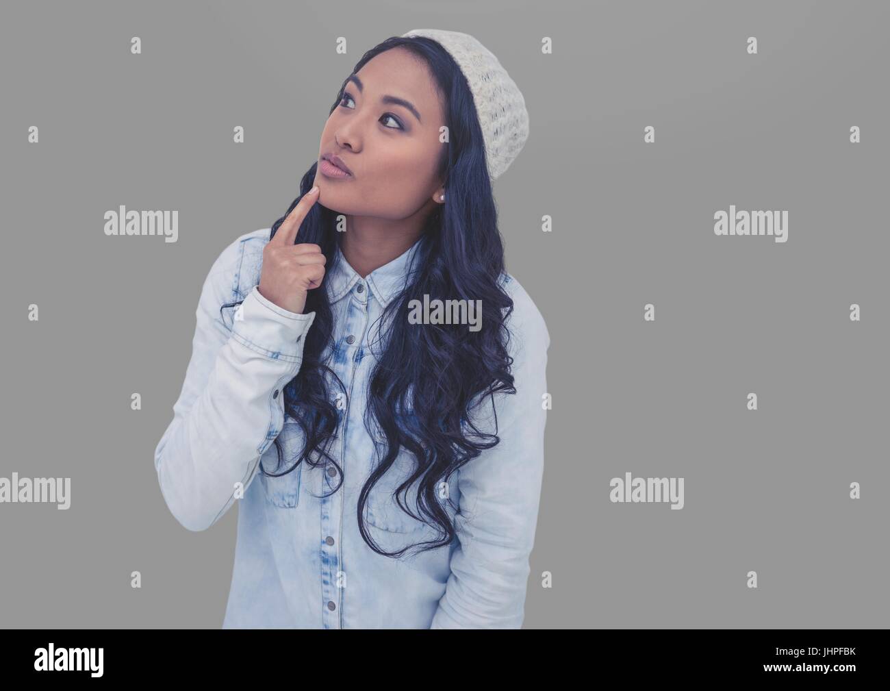 Digital composite of Portrait of woman curious with grey background ...