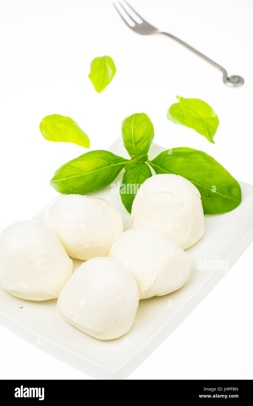 Mozzarella balls on white plate. Studio Photo Stock Photo - Alamy