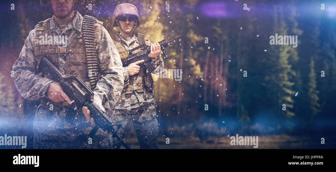 Pine trees in forest against confident military soldier standing with ...