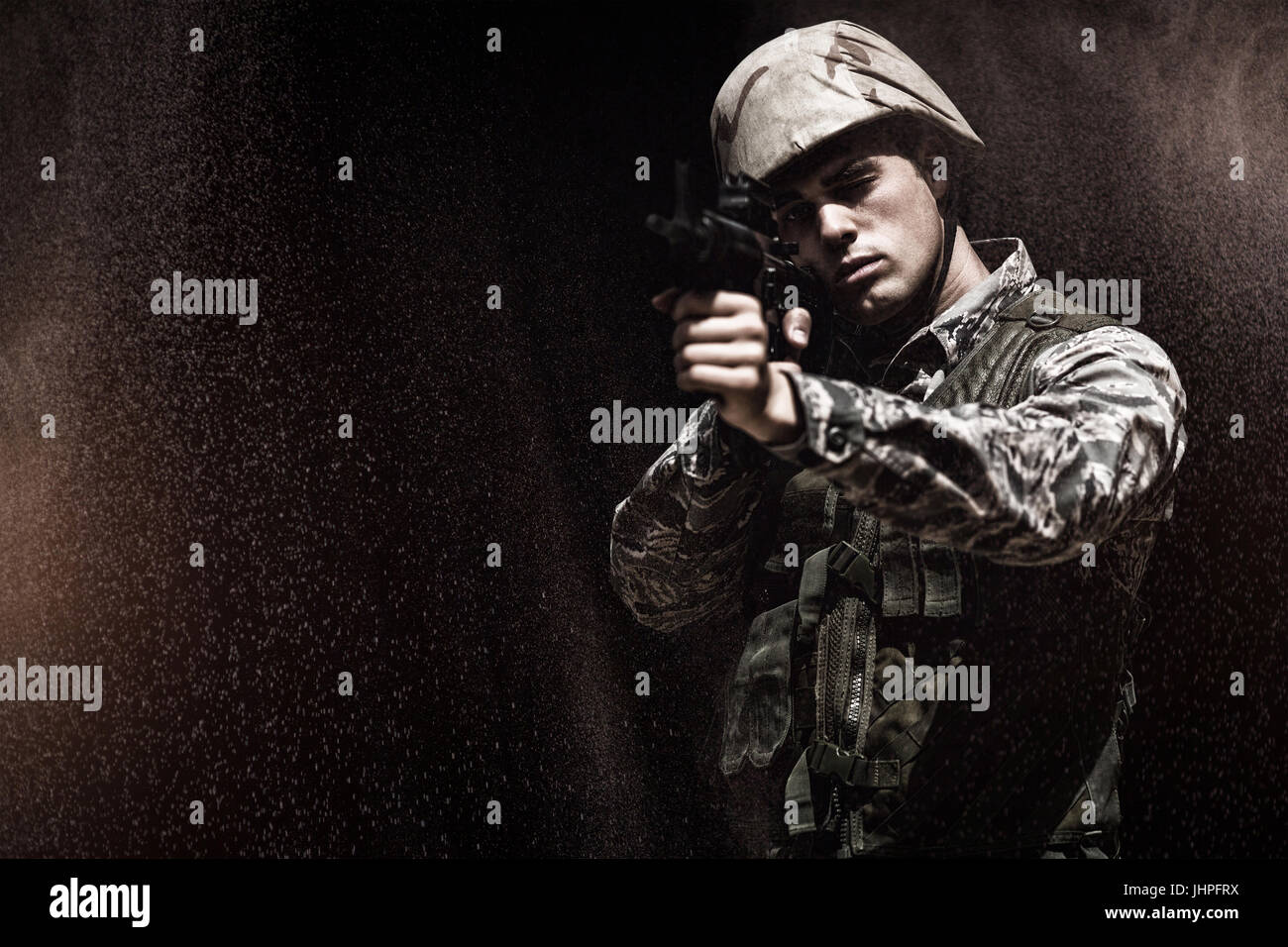 Black background against military soldier aiming with a rifle Stock ...