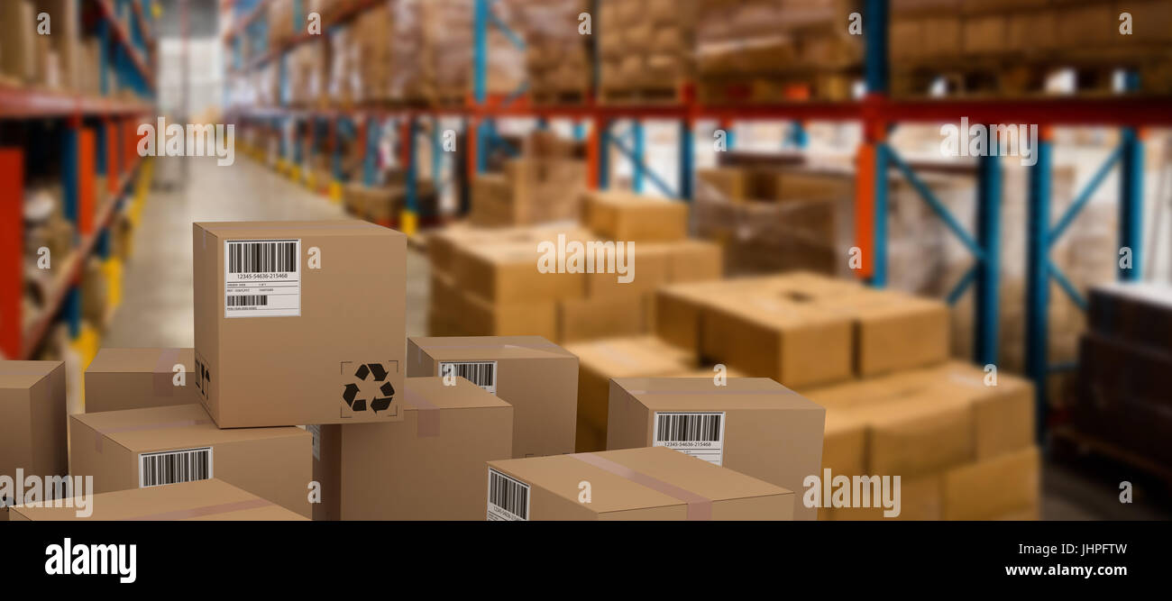 Group of composite cardboard boxes against boxes on pallet by rack ...