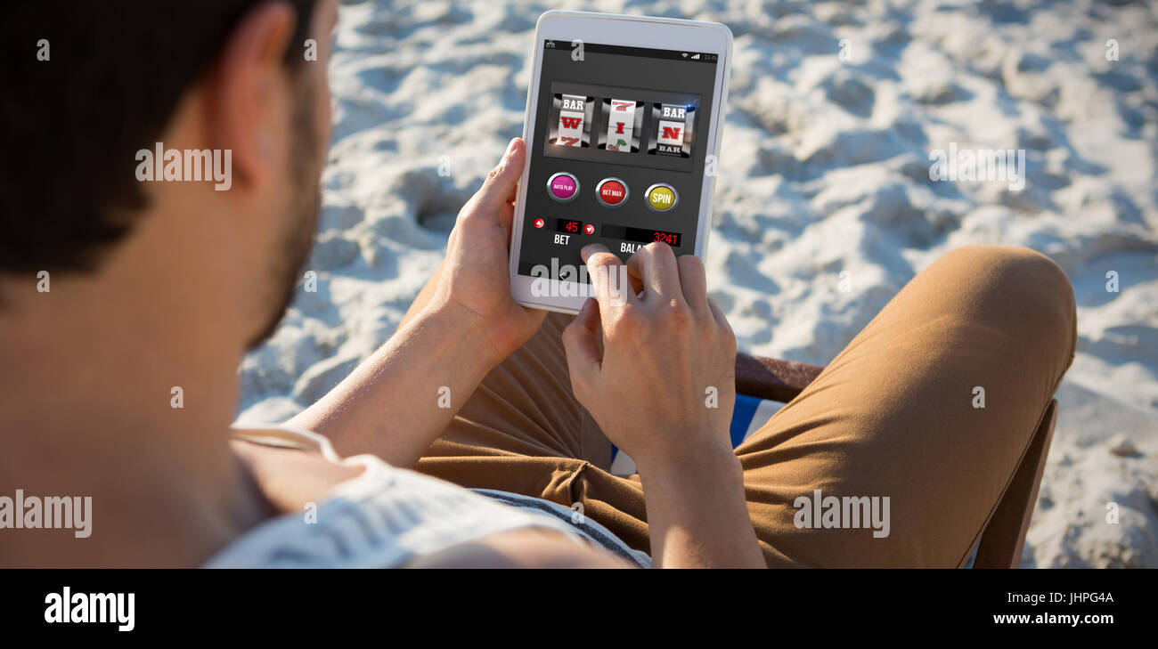 Slot machine with text and numbers on mobile screen against high angle ...