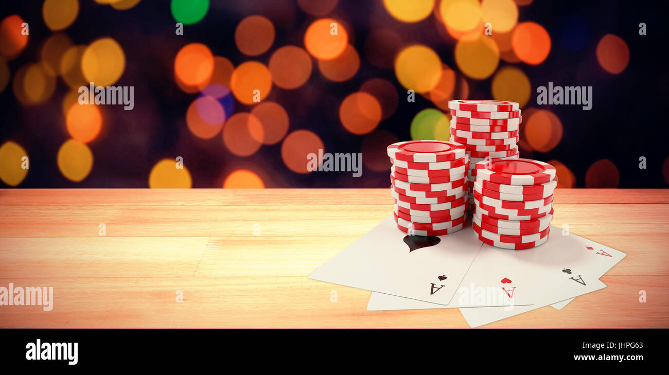Playing cards with red casino tokens against composite image of brown ...