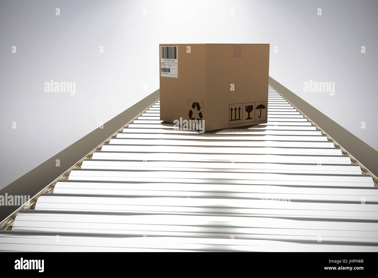 Packed parcel box on conveyor belt against grey background Stock Photo ...