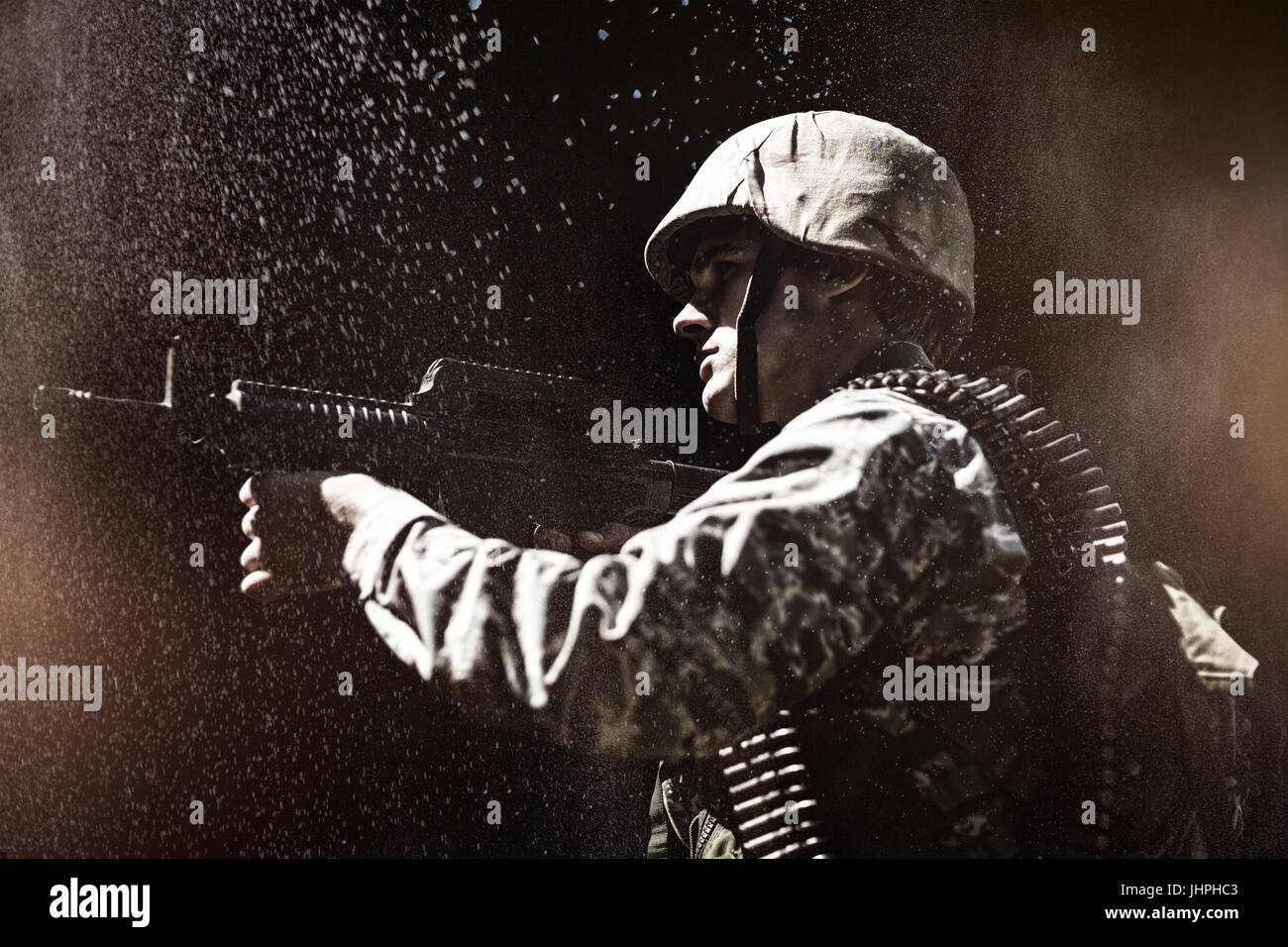 Black background against military soldier aiming with a rifle Stock ...