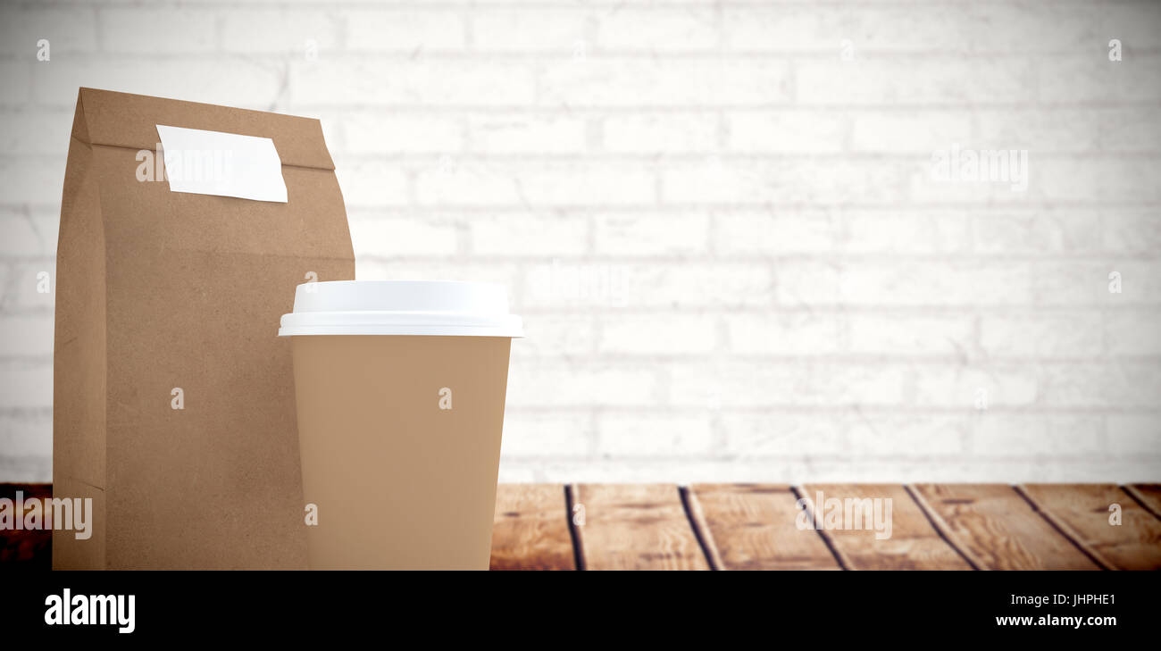 Disposable coffee cup and parcel bag against white wall Stock Photo - Alamy