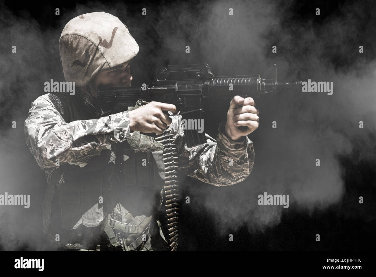 Black background against military soldier aiming with a rifle Stock ...