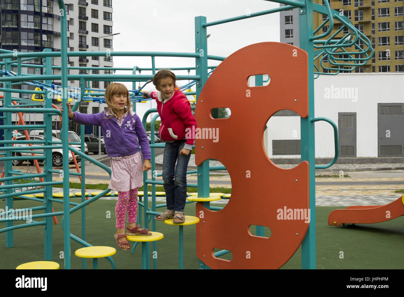 Joyful active childhood. Playful kids playing on playground. Children ...