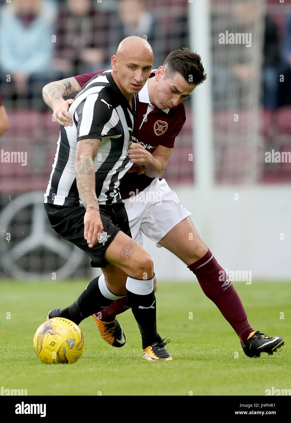 Hearts' Jamie Walker (right) and Newcastle's Jonjo Shelvey battle for ...