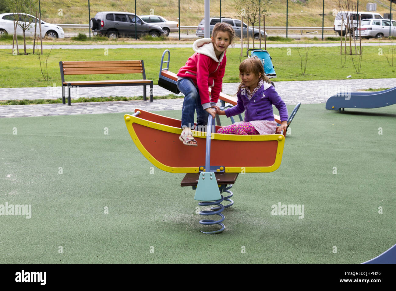 Happy children playing outdoors Stock Photo - Alamy