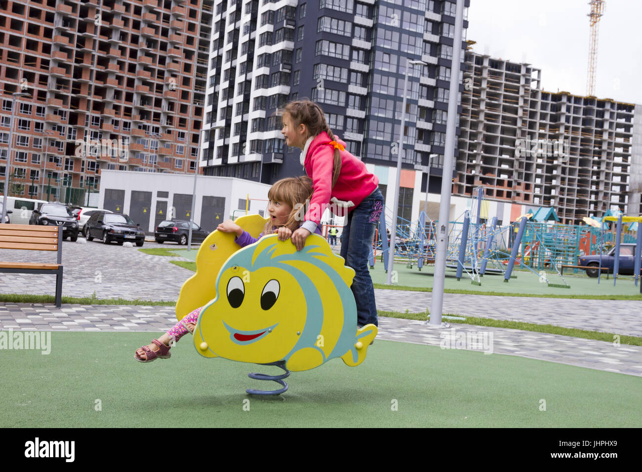 Happy children playing outdoors Stock Photo - Alamy