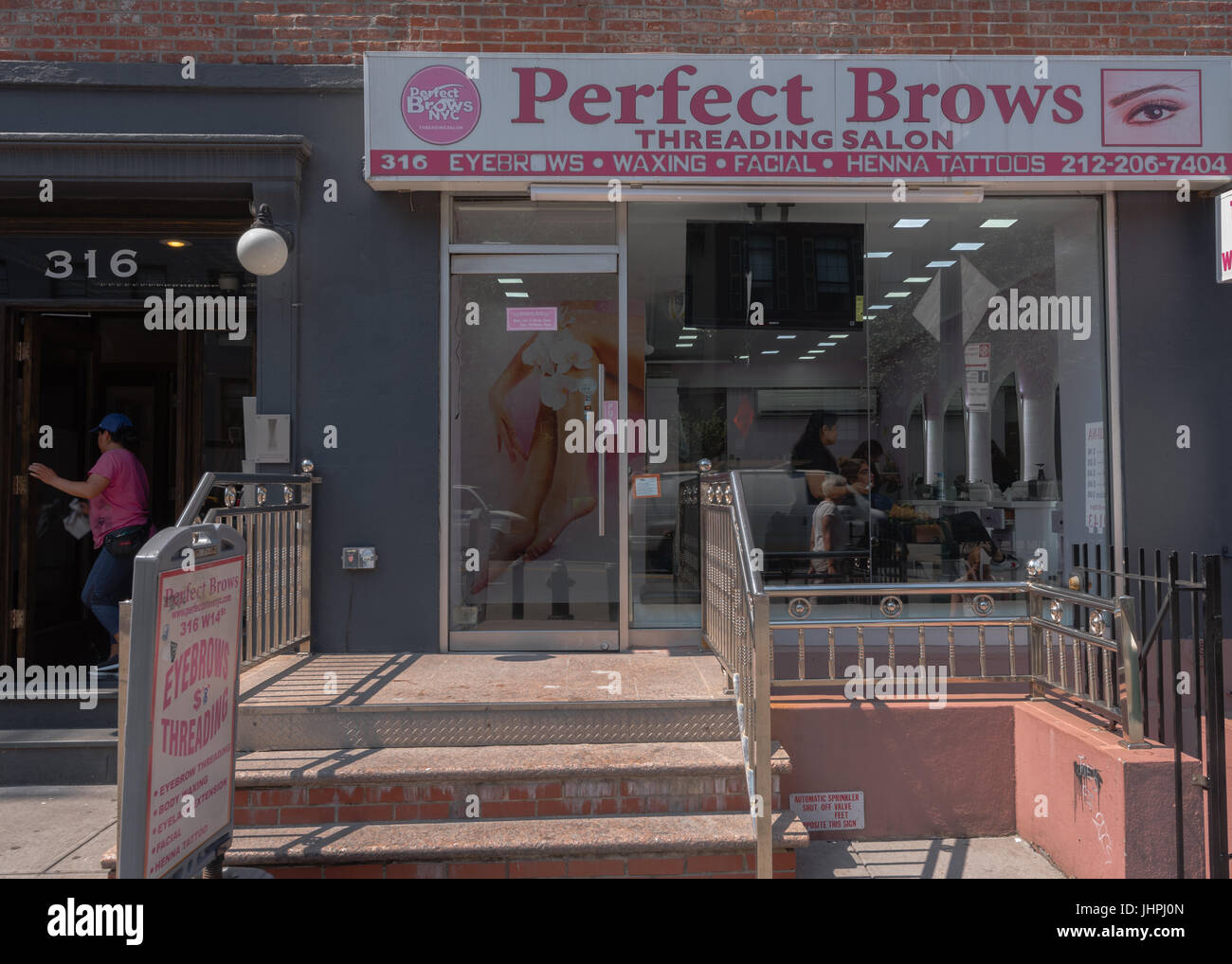 New York, NY USA -- July 12, 2017 -- A view into a threading salon from ...
