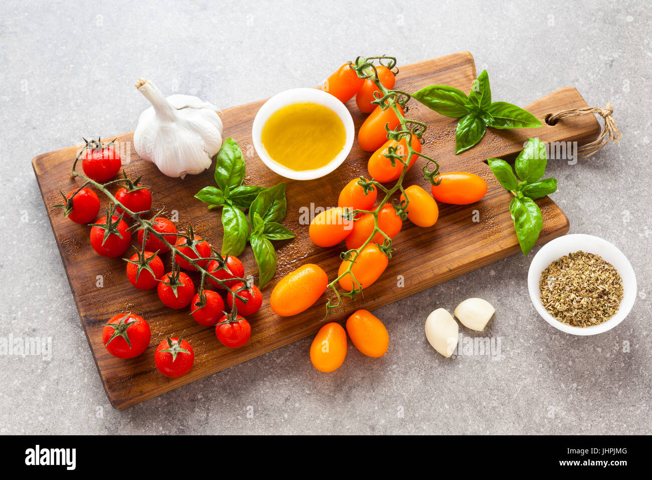Fresh summer ingredients on a wooden board on grey background Stock ...