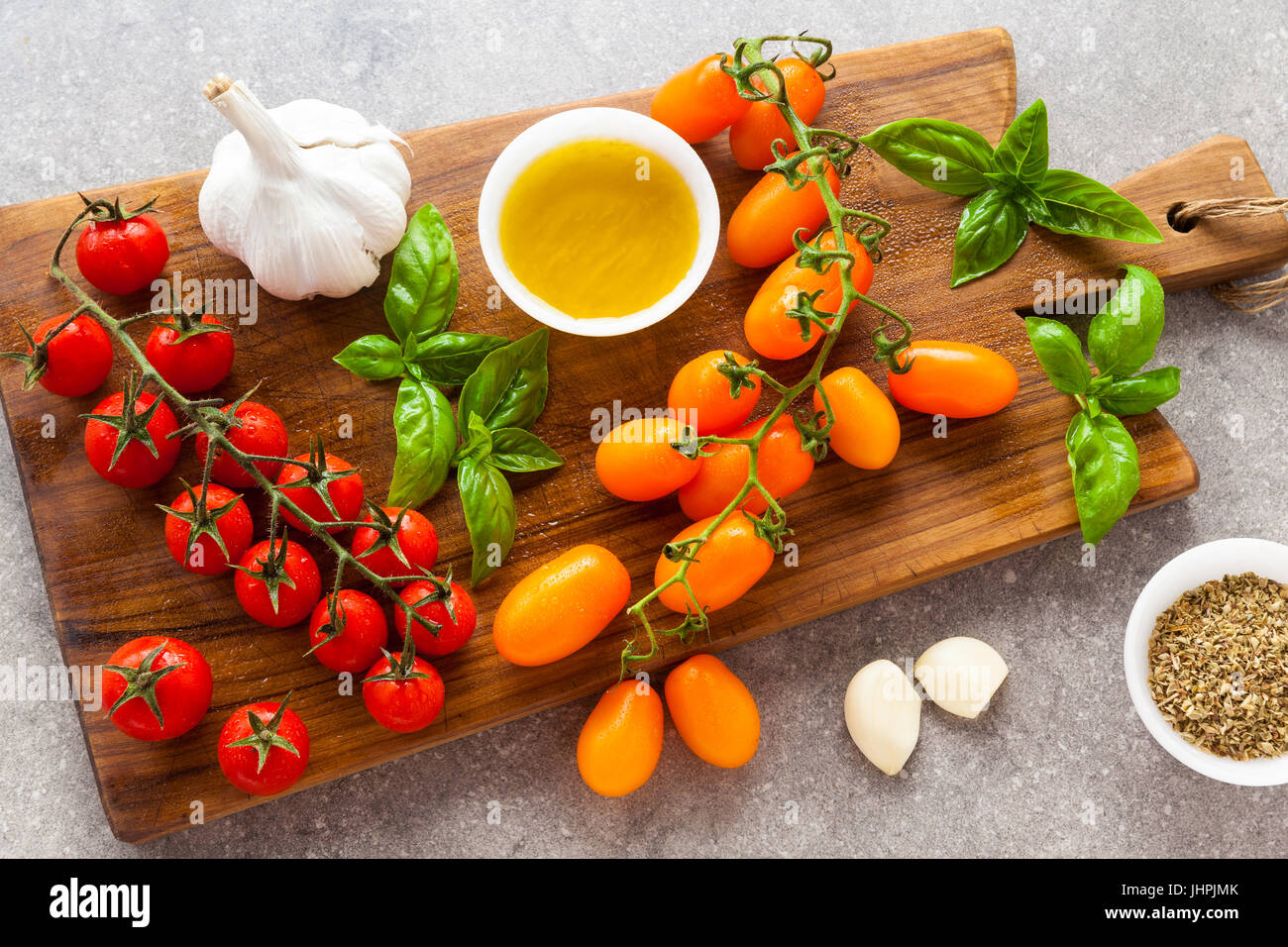 Fresh summer ingredients on a wooden board on grey background Stock ...