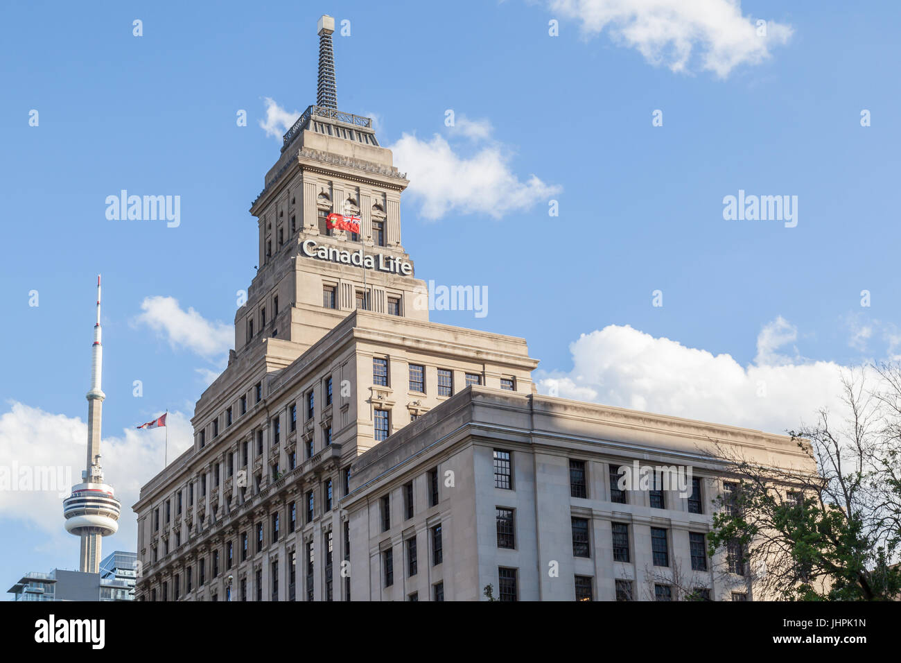 Upper part of Canada Life Building with CN tower in background Stock ...