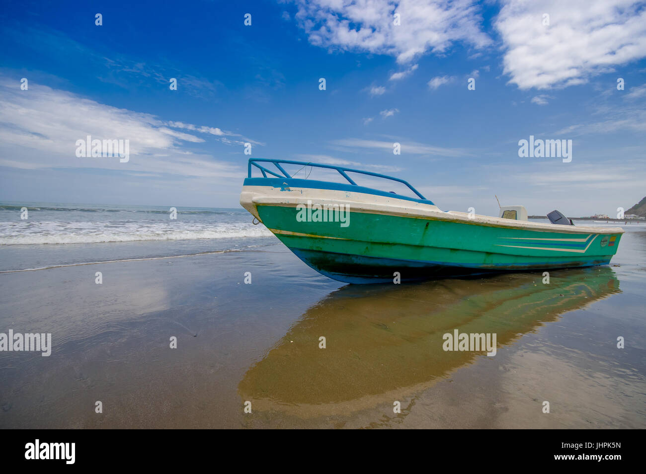 SAME, ECUADOR - MAY 06 2016: Fishing boat on the beach in the sand in a ...