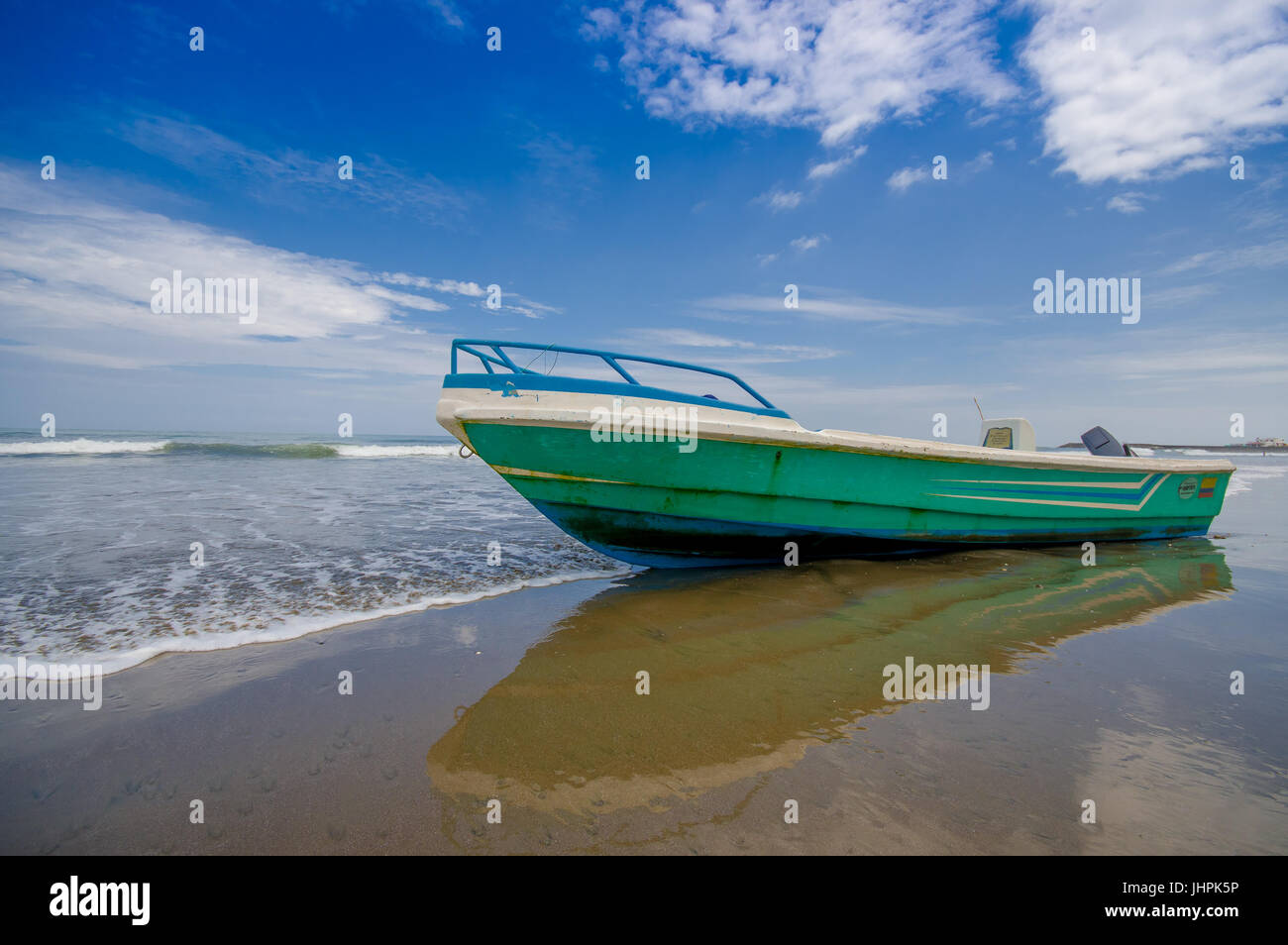 SAME, ECUADOR - MAY 06 2016: Fishing boat on the beach in the sand in a ...