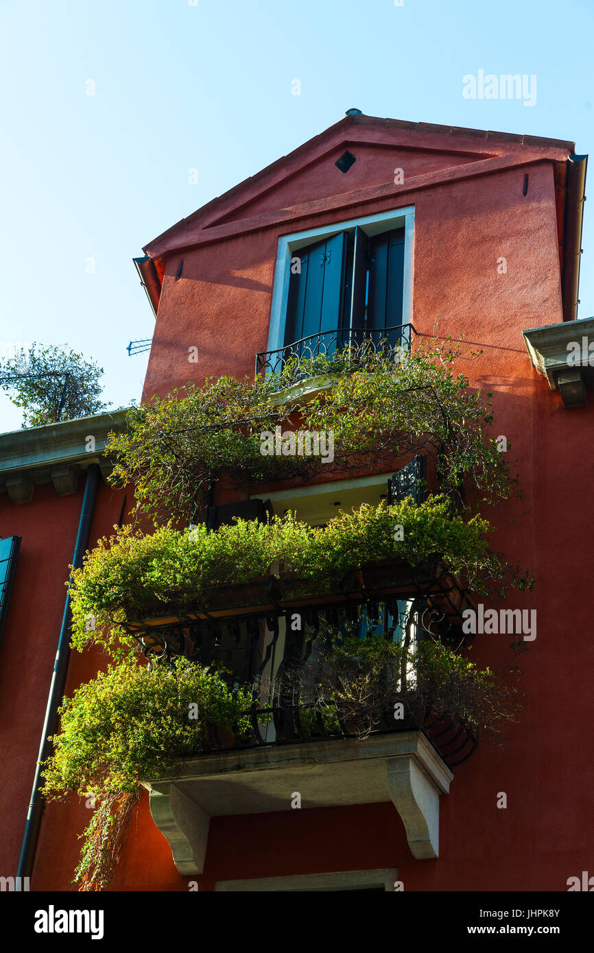 The facade of a house in Venice with windows Stock Photo - Alamy