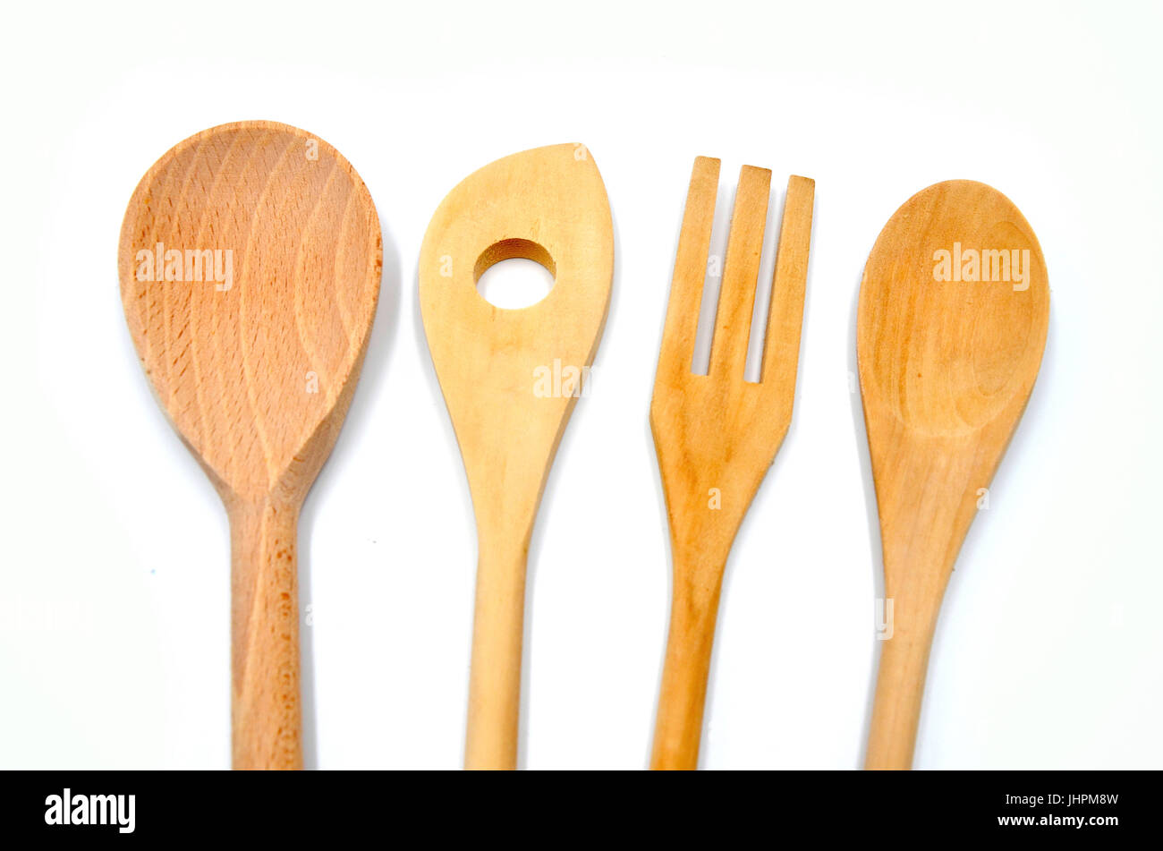 Wooden cooking spoons on white background Stock Photo - Alamy