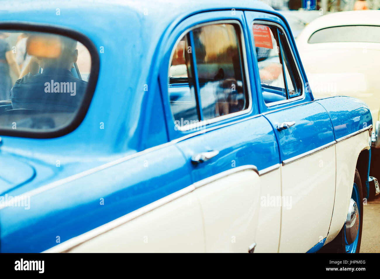 Retro car rear lantern on city street Stock Photo - Alamy