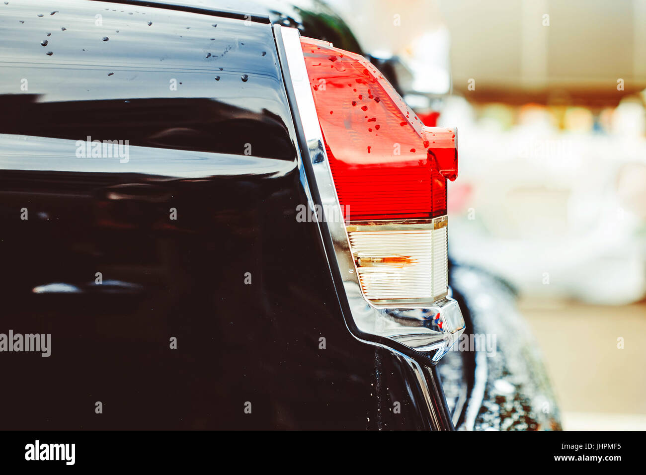 Retro car rear lantern on city street Stock Photo - Alamy