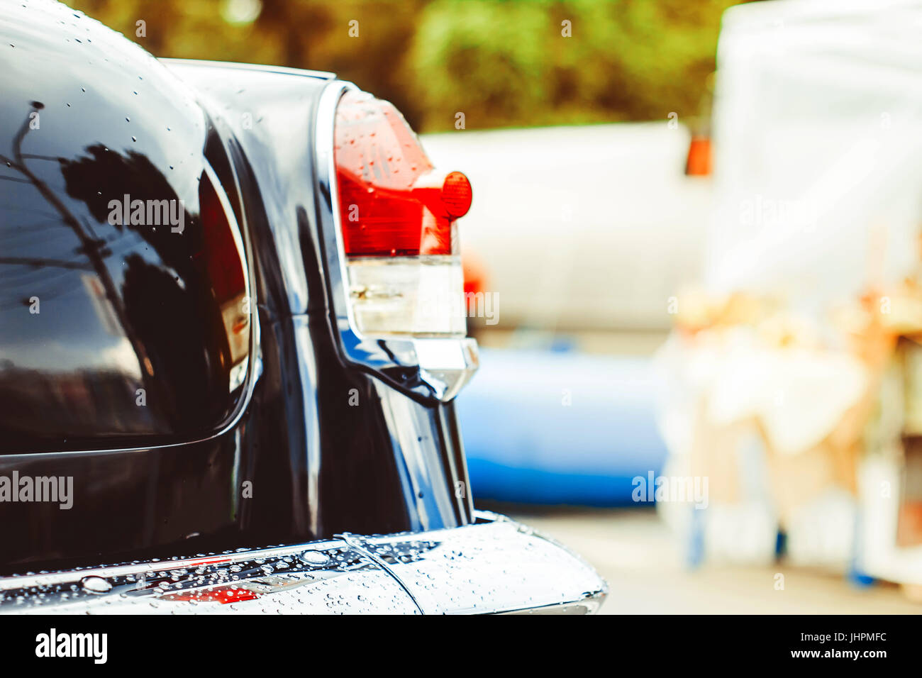 Retro car rear lantern on city street Stock Photo - Alamy