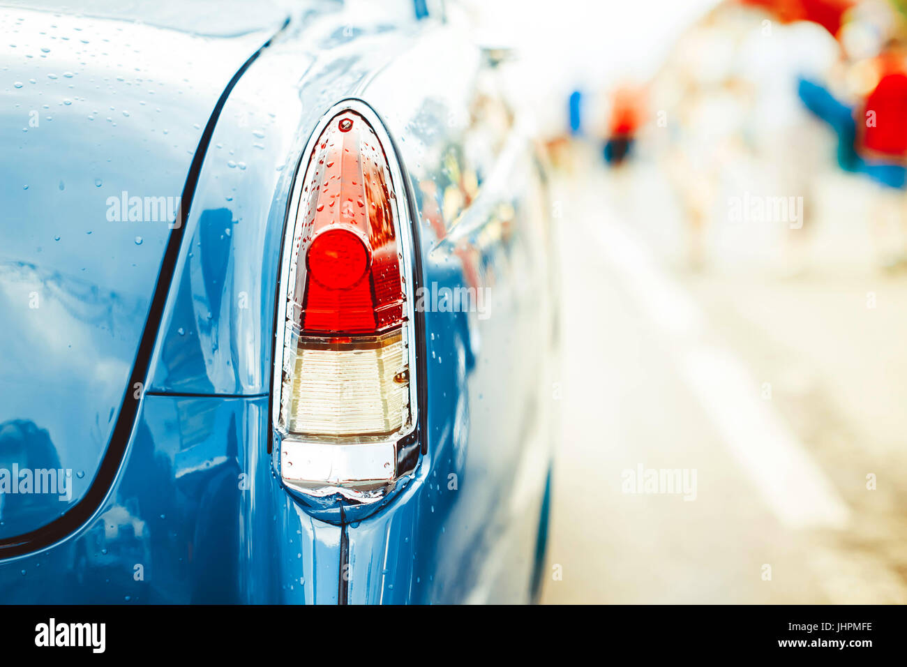 Retro car rear lantern on city street Stock Photo - Alamy