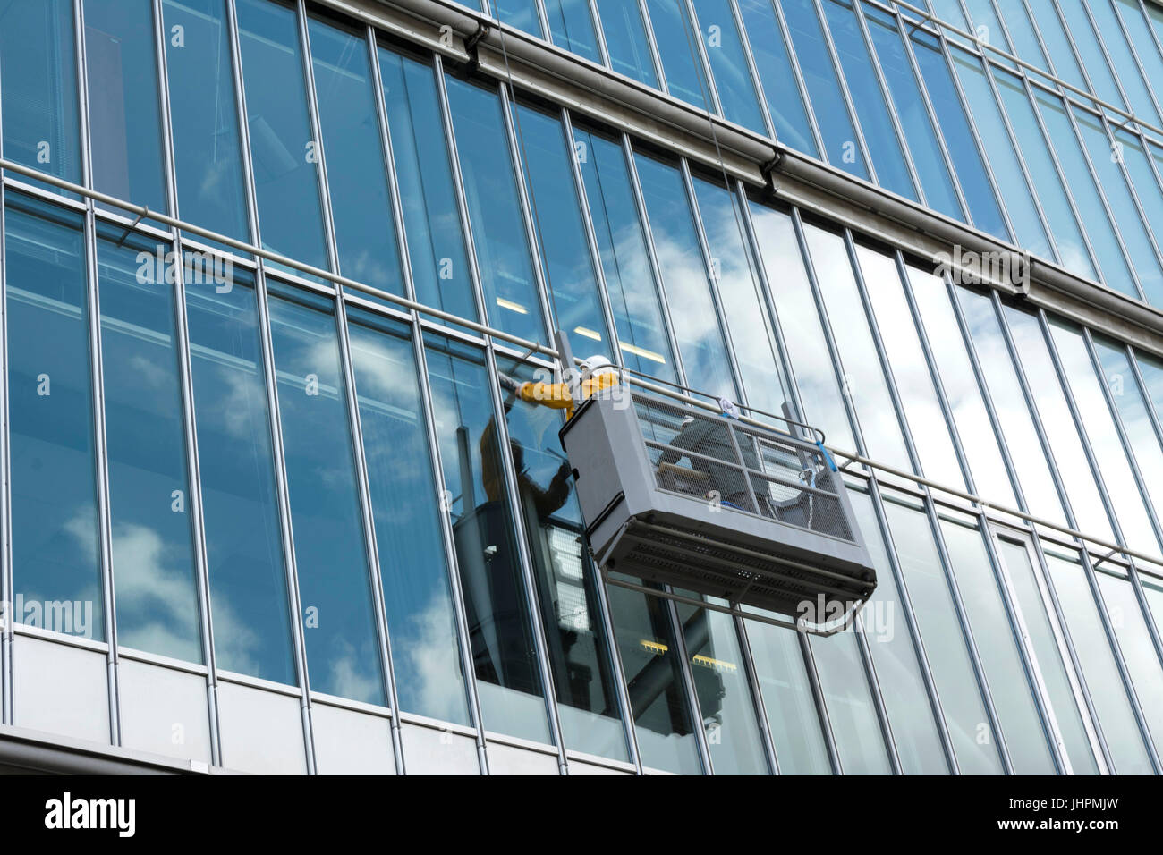Window washer on modern office building in Geneva, Switzerland Stock ...