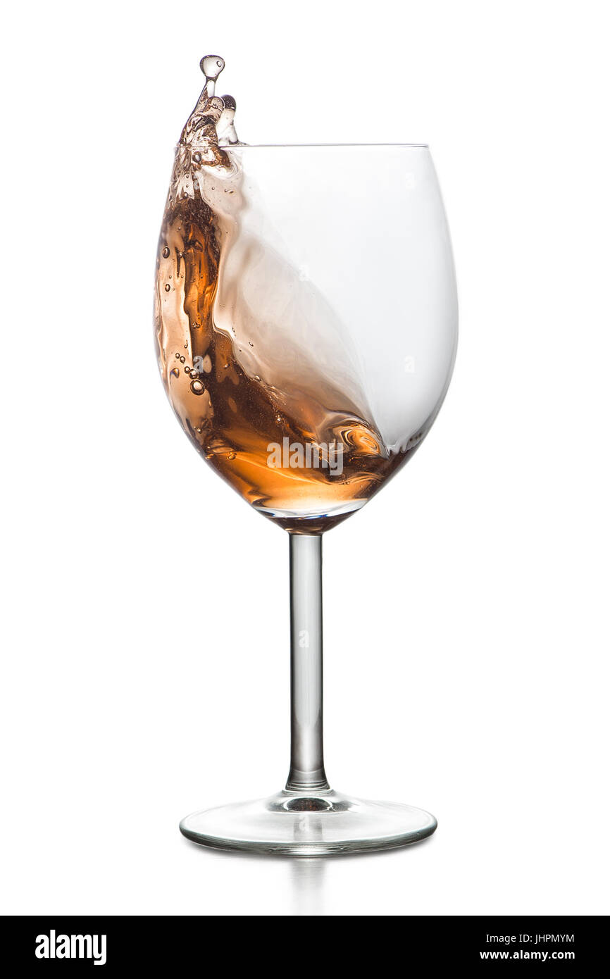 Splashing drink in glass isolated on white background Stock Photo - Alamy