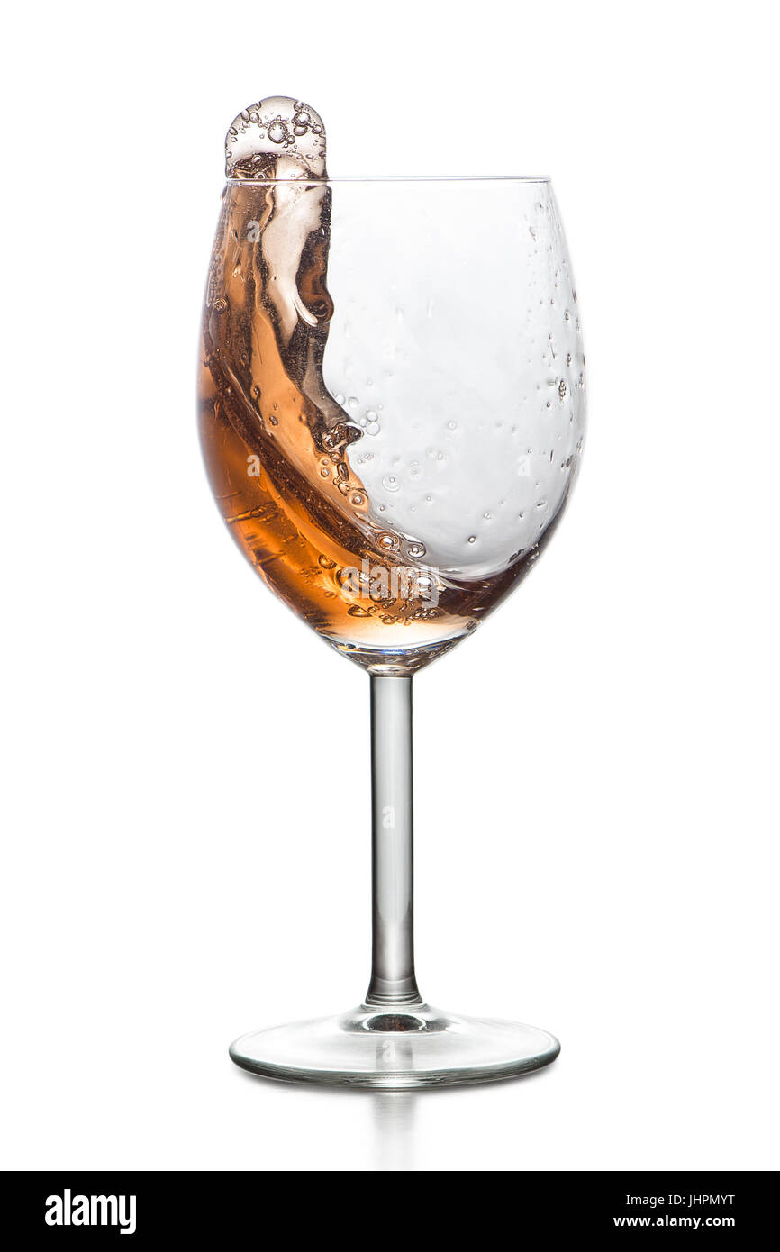 Splashing drink in glass isolated on white background Stock Photo - Alamy