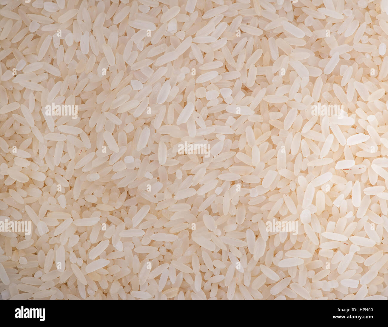 Uncooked organic brown rice texture Stock Photo - Alamy