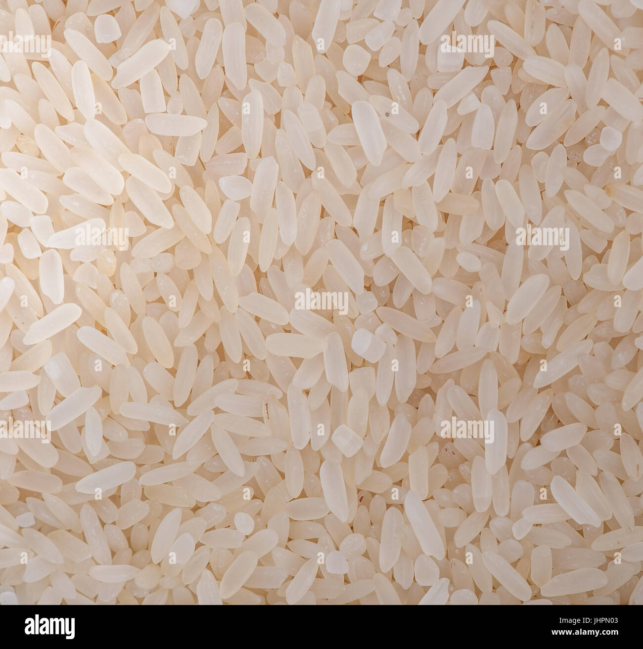 Uncooked organic brown rice texture Stock Photo - Alamy
