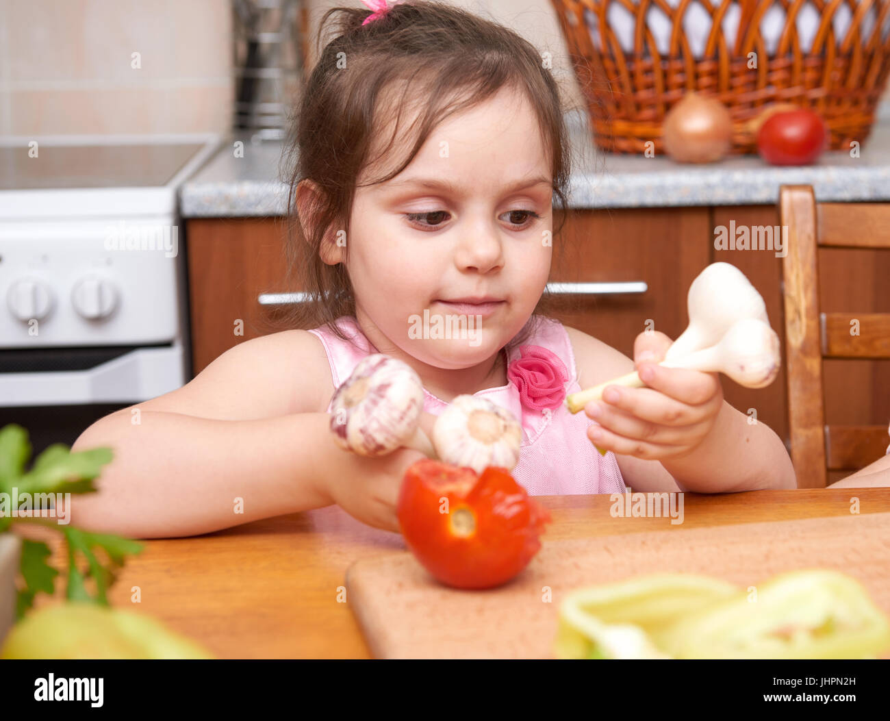 Children at the table with with fresh fruits and vegetables, home ...