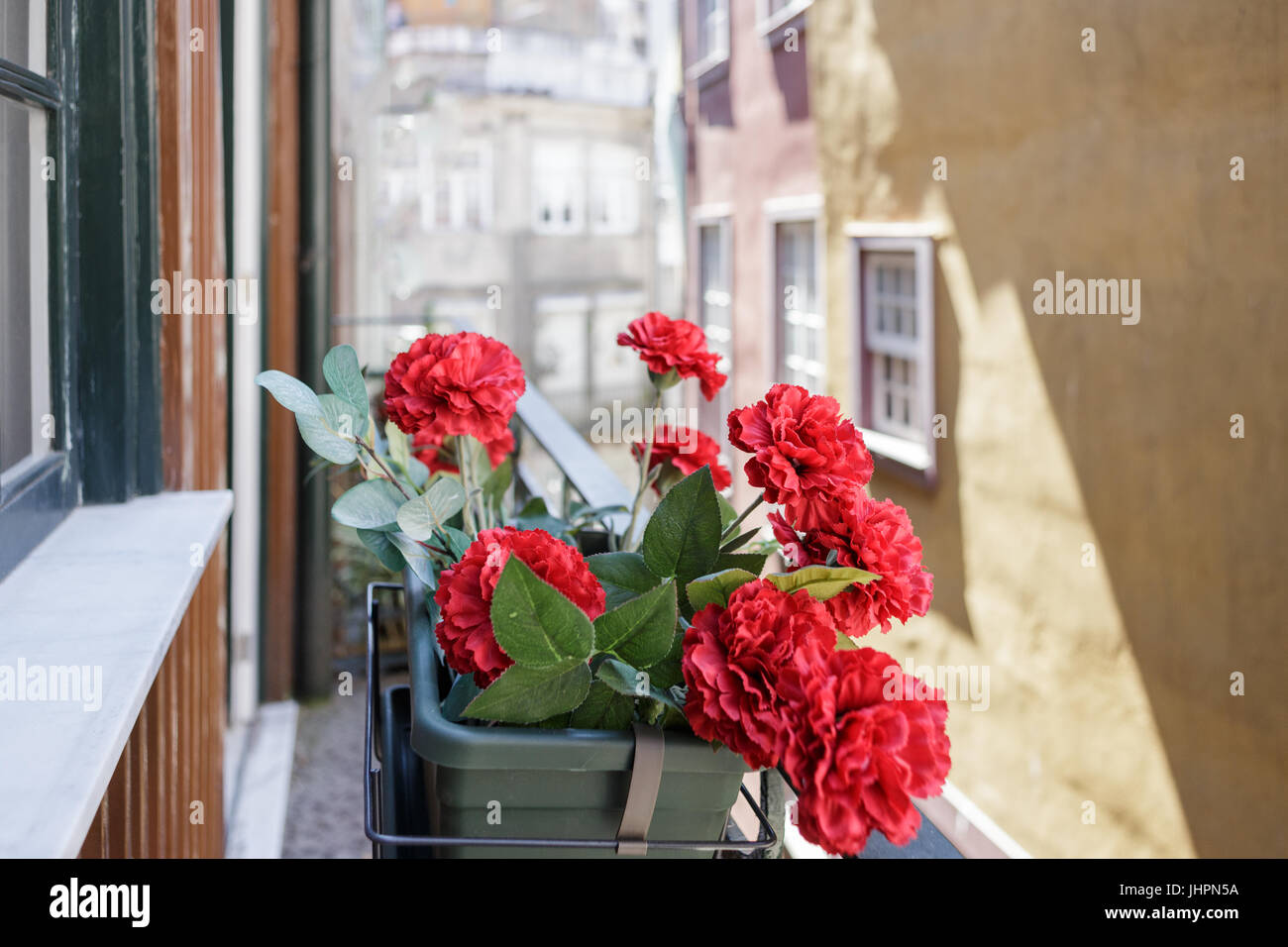 Flower arrangement on a window sill Stock Photo - Alamy