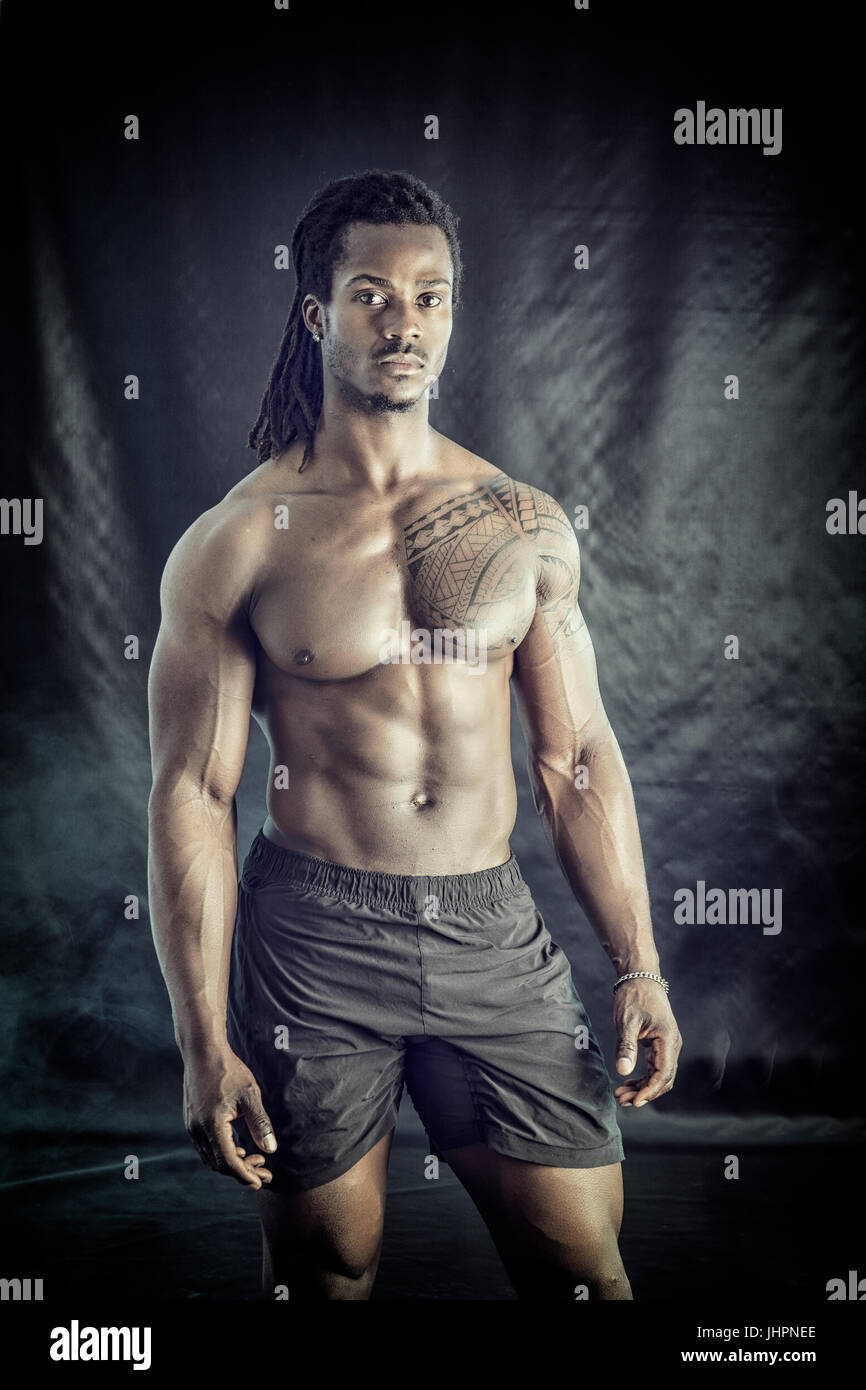 African American bodybuilder man, naked muscular torso, wearing ...