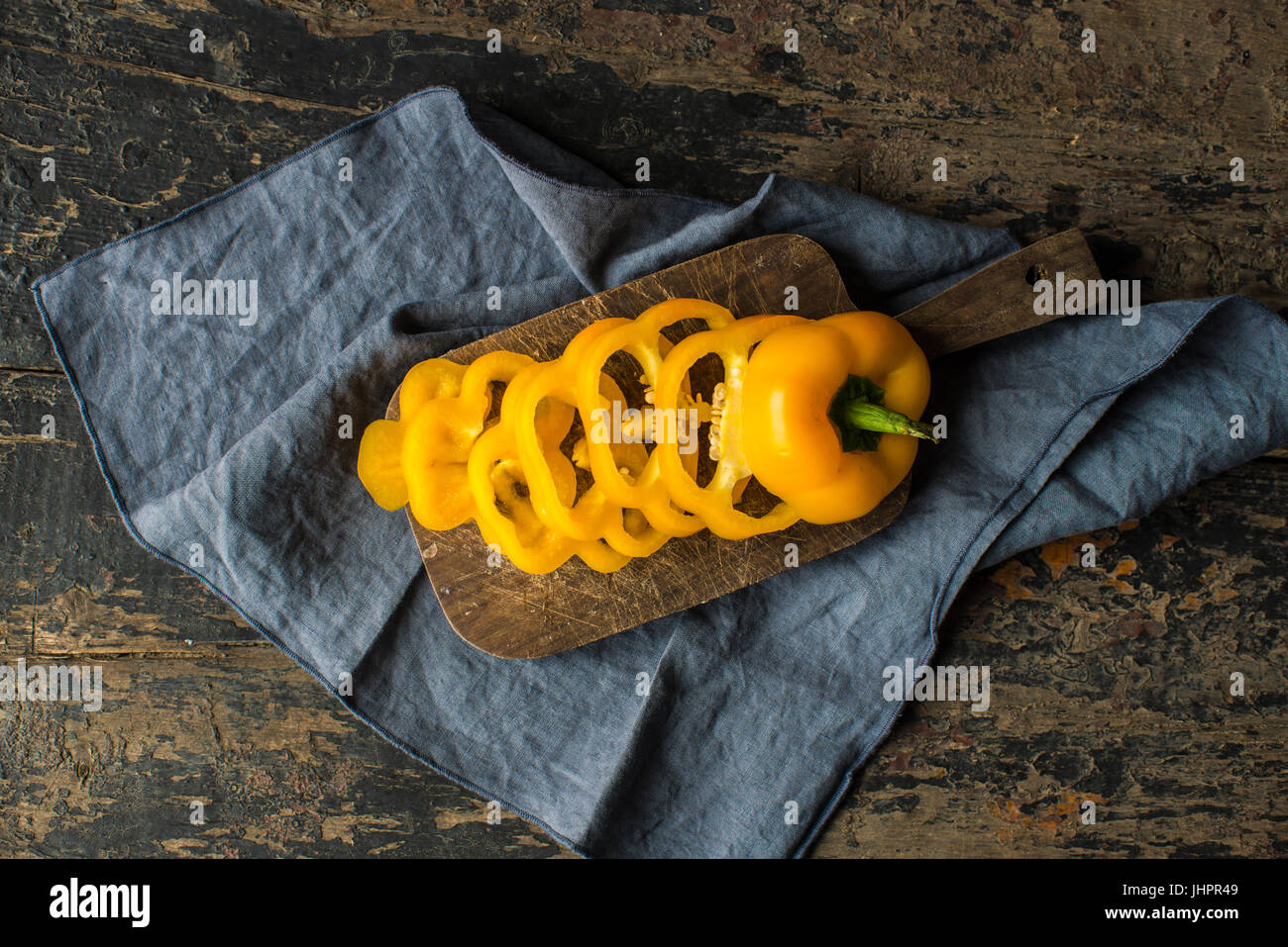 Healthy food concept yellow sliced bell pepper vegetable on a cutting ...