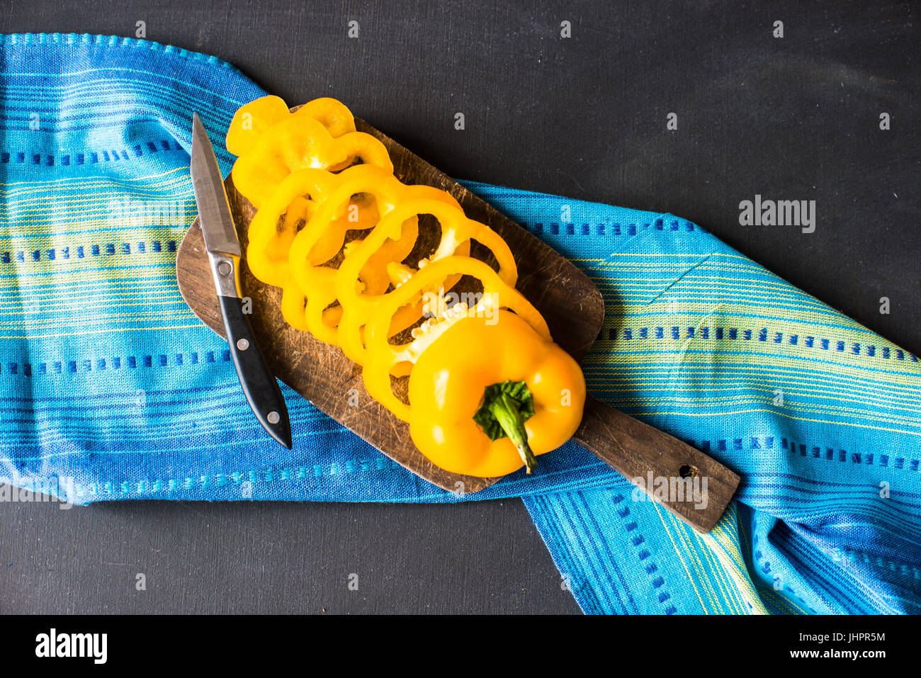 Healthy food concept yellow sliced bell pepper vegetable on a cutting ...