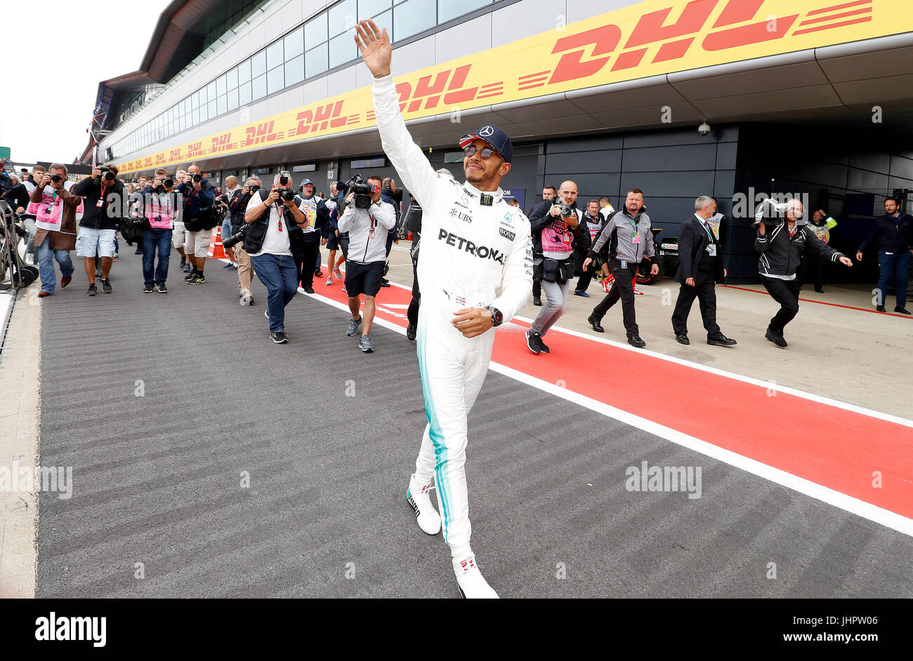 Mercedes' Lewis Hamilton celebrates after qualifying in pole position ...