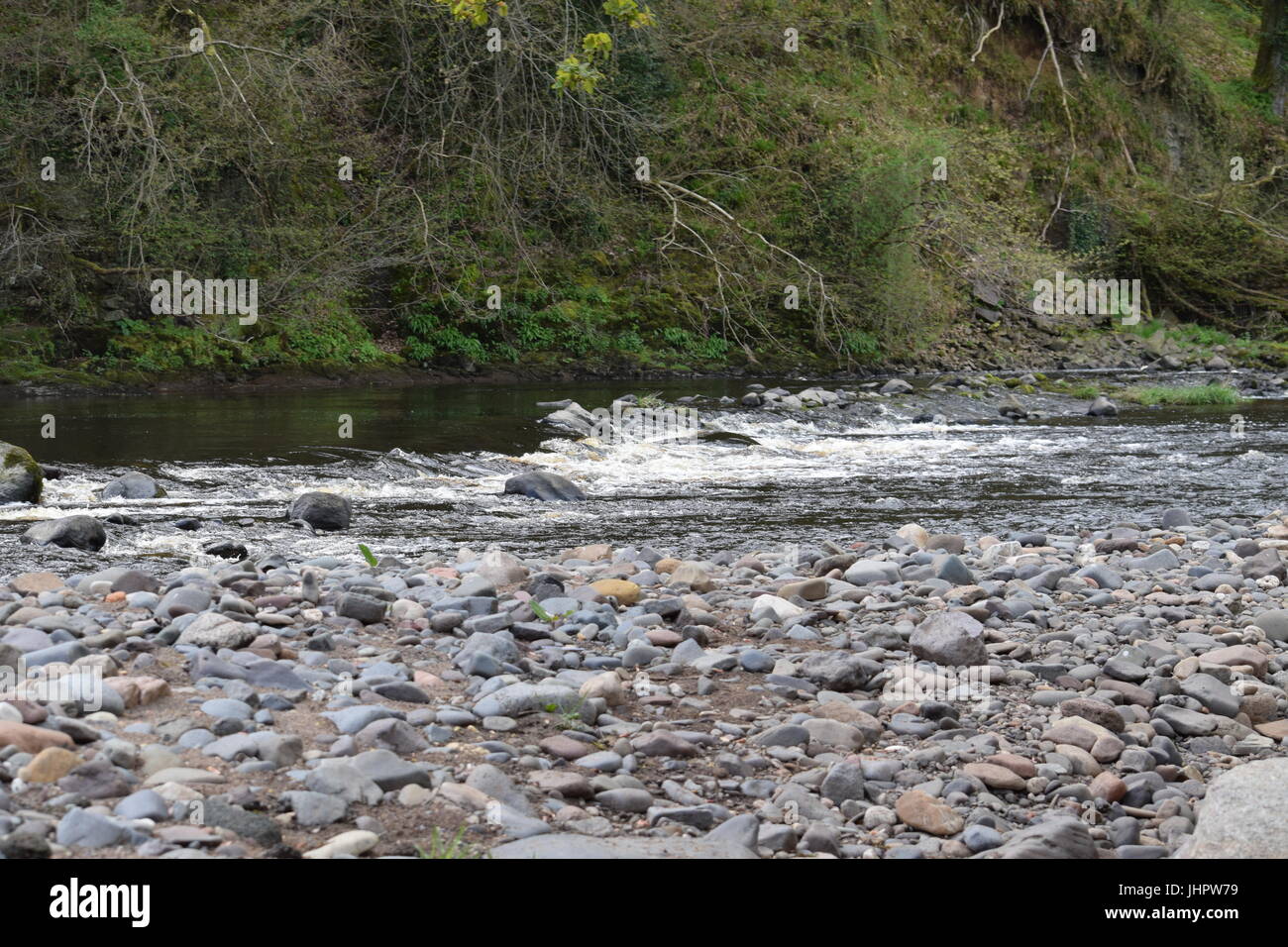 Water over a natural weir Stock Photo - Alamy