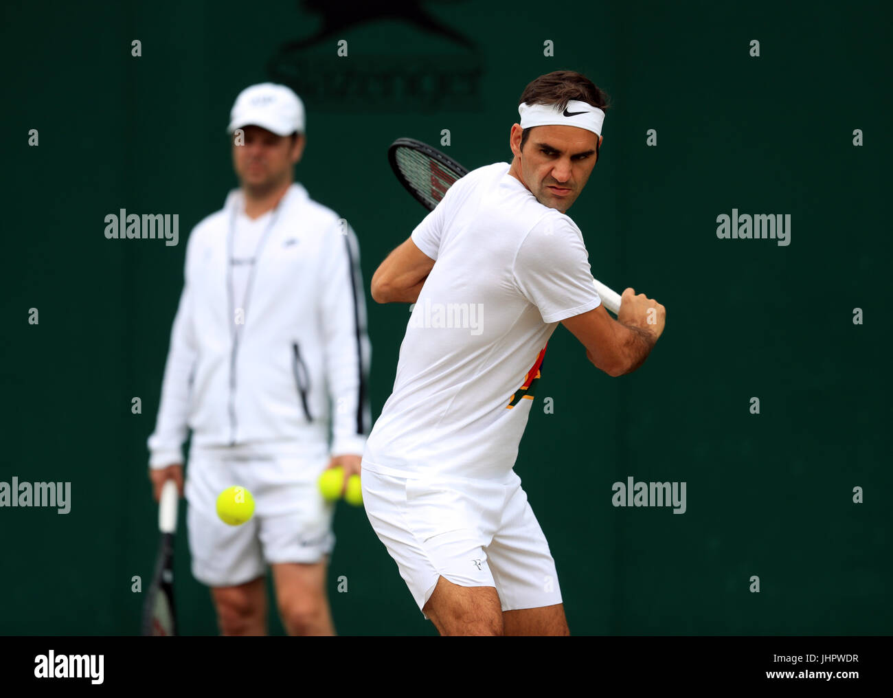 Roger Federer during a training session on day twelve of the Wimbledon ...