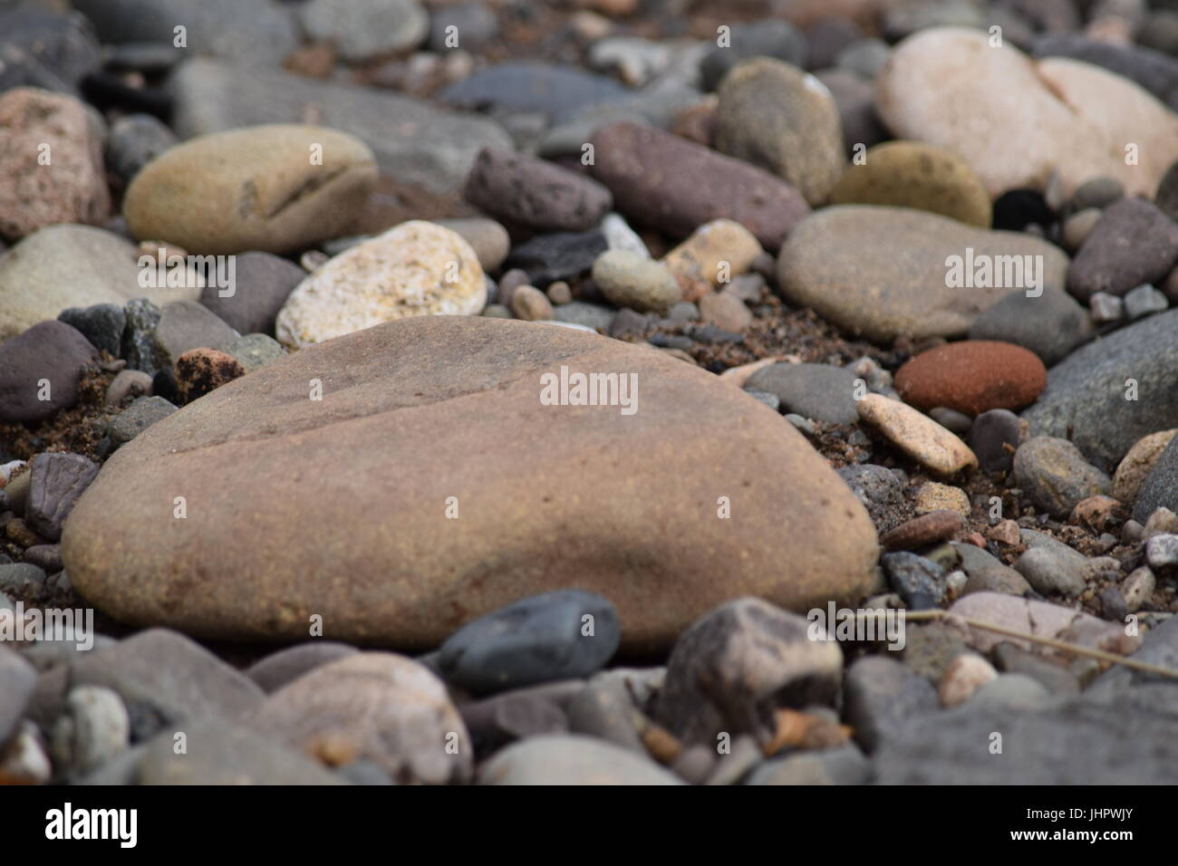 Rocks and sand Stock Photo - Alamy