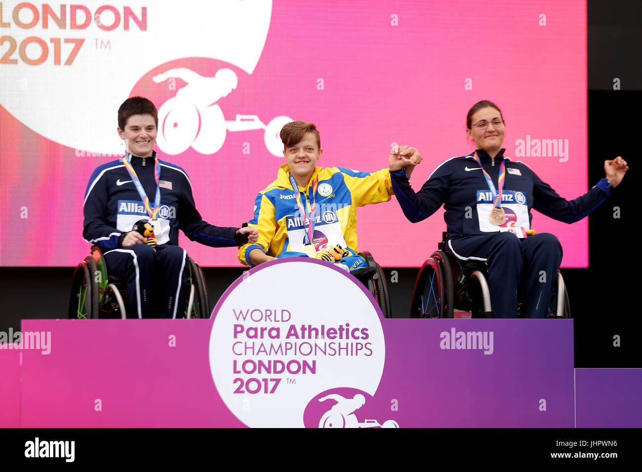 Ukraine's Zoia Ovsii (centre) with her gold medal, USA's Cassie ...