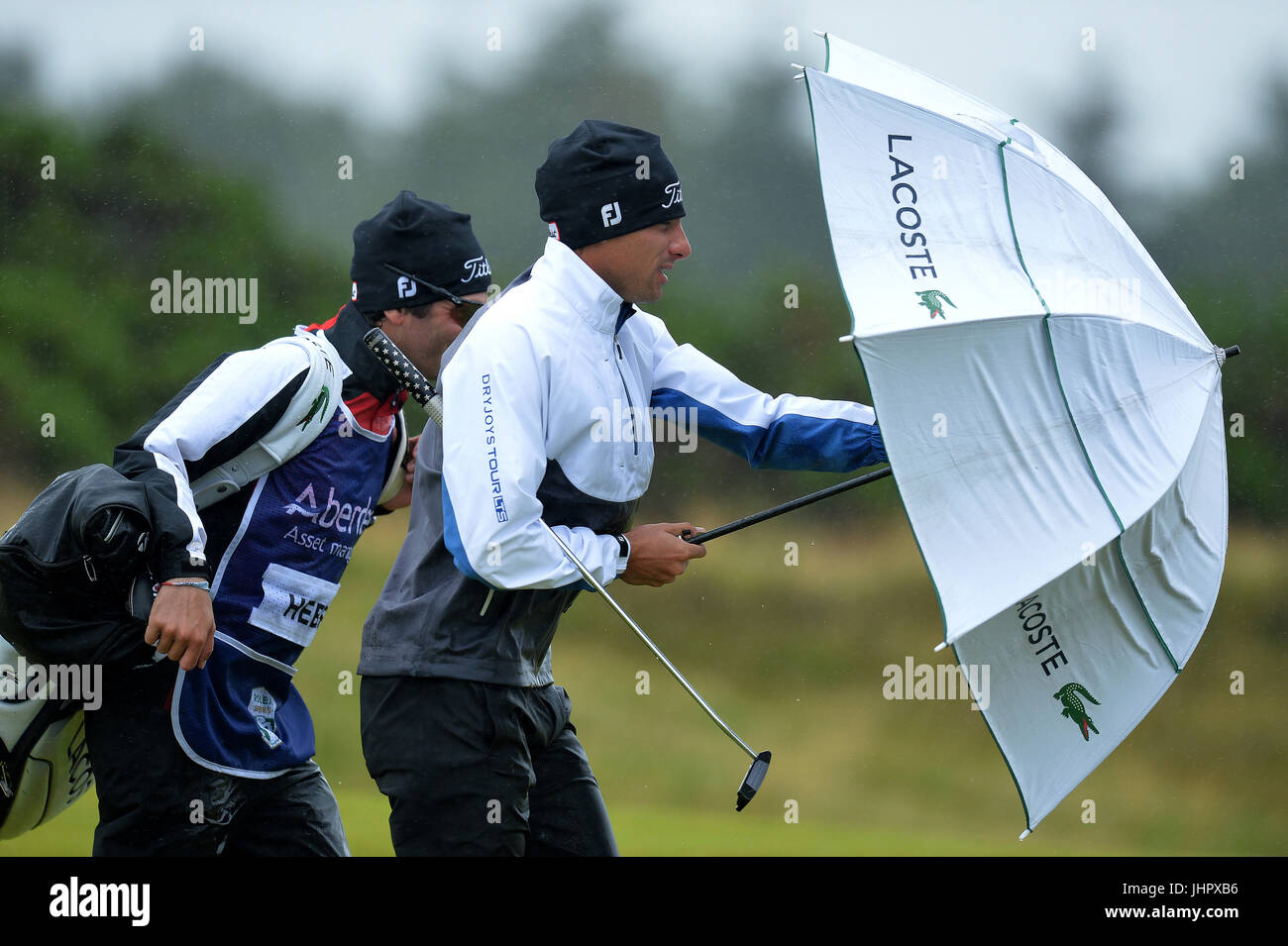France's Benjamin Hebert battles through the rain and wind at the 5th ...