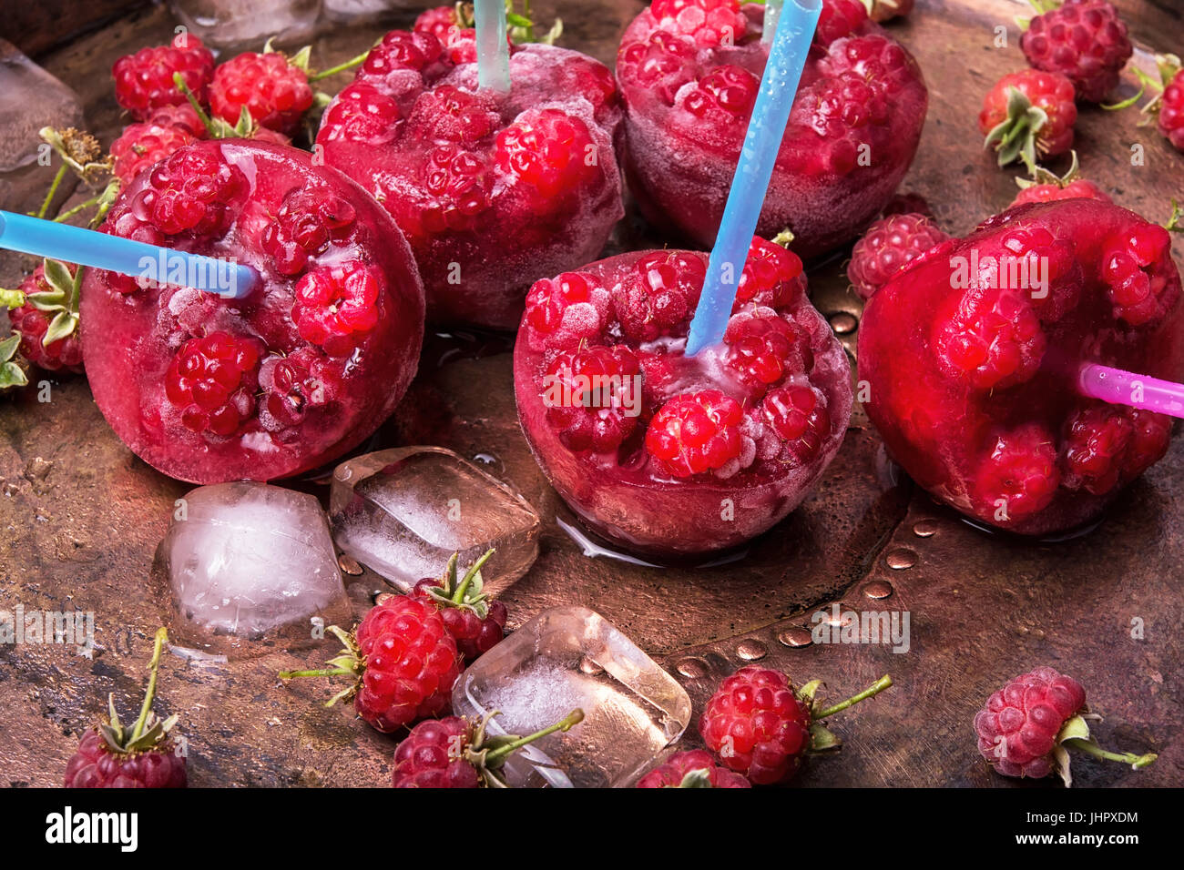 Close up of frozen raspberry juice with ice Stock Photo - Alamy