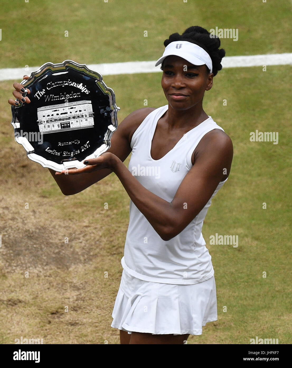 Venus Williams with the runners-up trophy following defeat in the ...