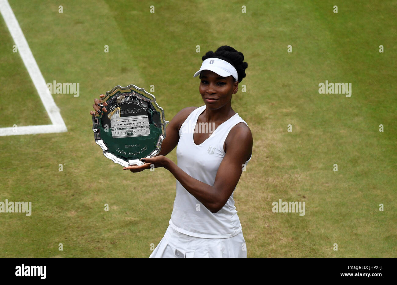 Venus Williams with the runners-up trophy following defeat in the ...