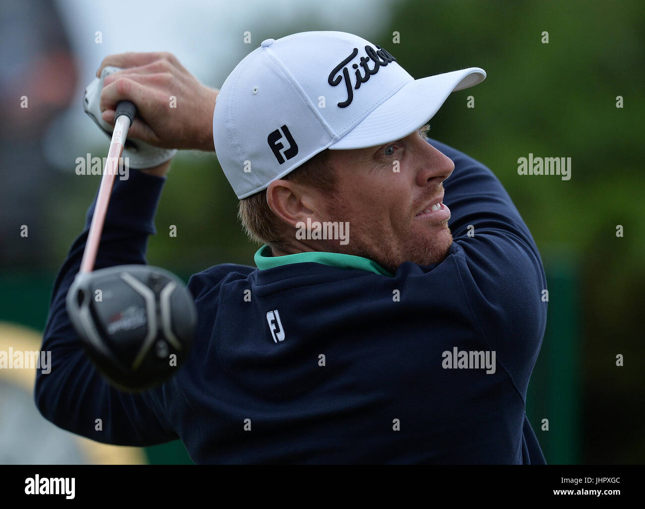 Australia's Andrew Dodt plays his tee shot to the 18th hole during day ...