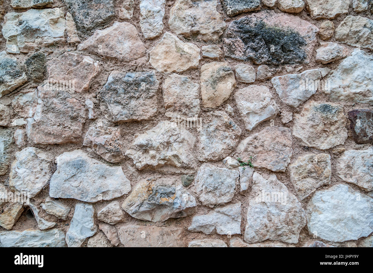 A close up view of an old stone wall Stock Photo - Alamy